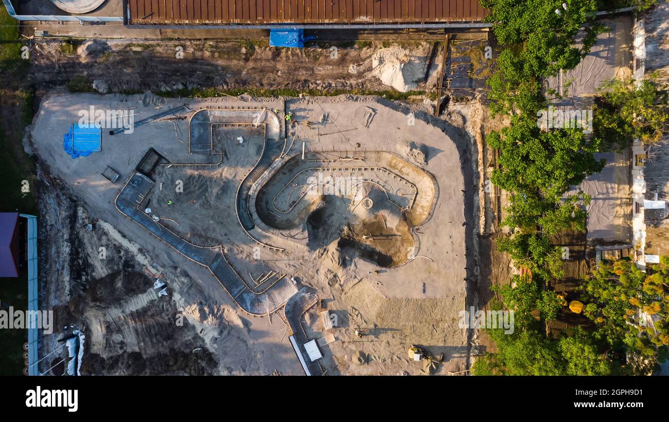 construction machinery on the sports field. construction of athletic ...