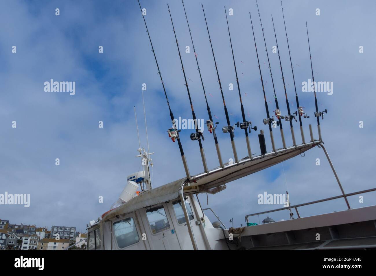 A Line Of Ten Hand Fishing Rods On A Cornish Boat In St. Ives Harbour ...