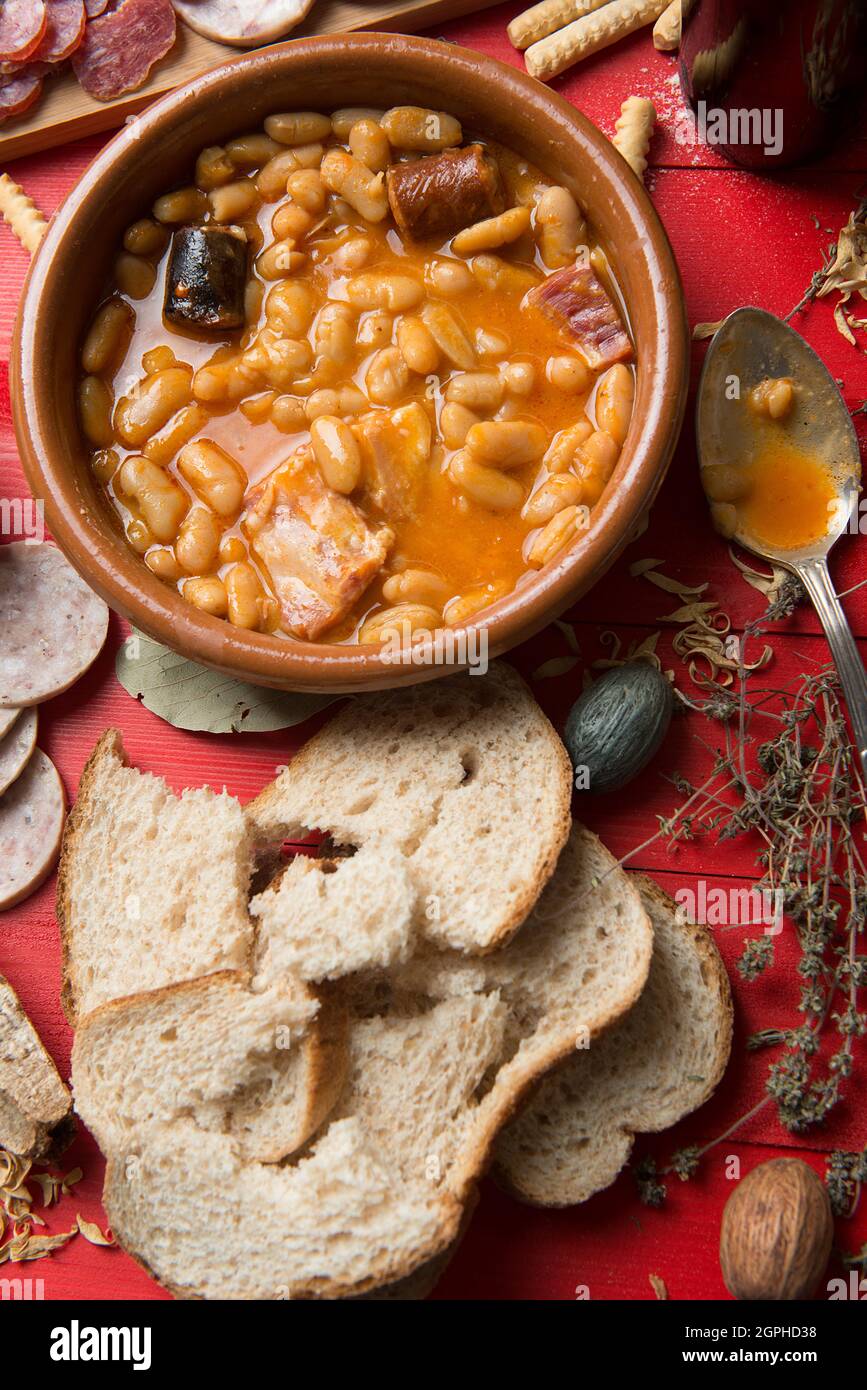 Asturian bean dish on a table full of food Stock Photo - Alamy