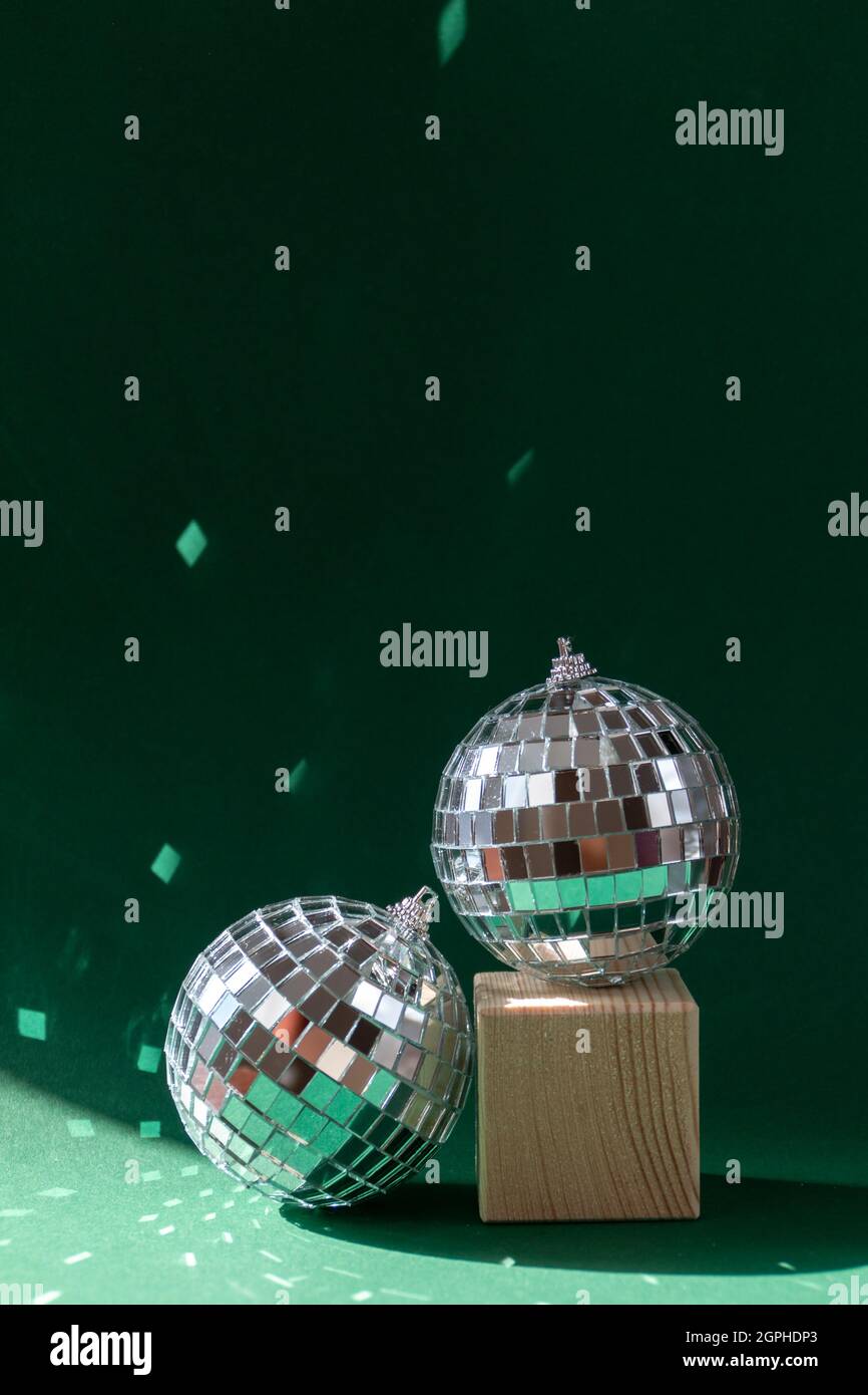 Still life with wooden cubes and disco ball reflecting sun flares ...