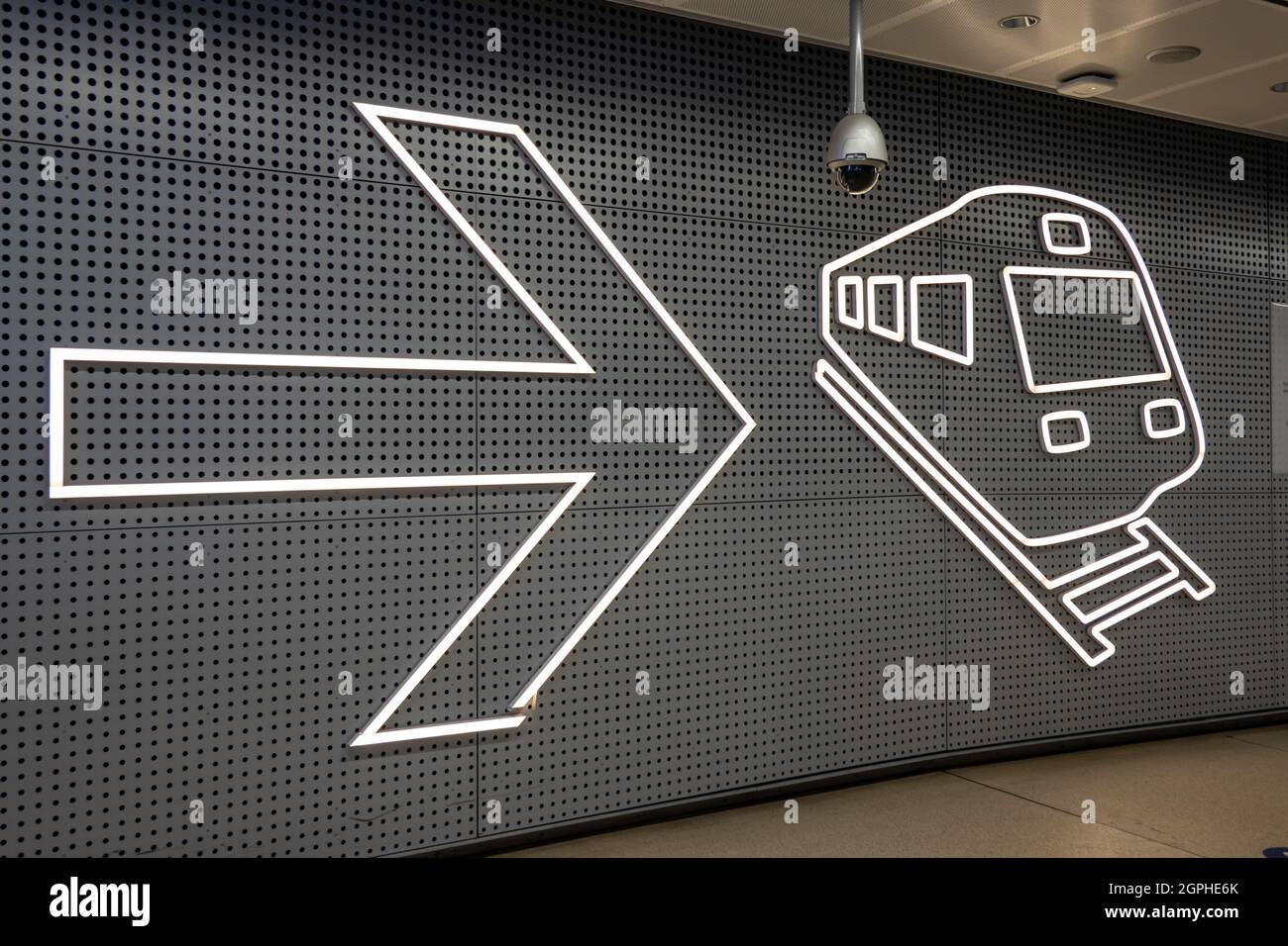 Neon sign pointing direction to railway station at Helsinki-Vantaa ...