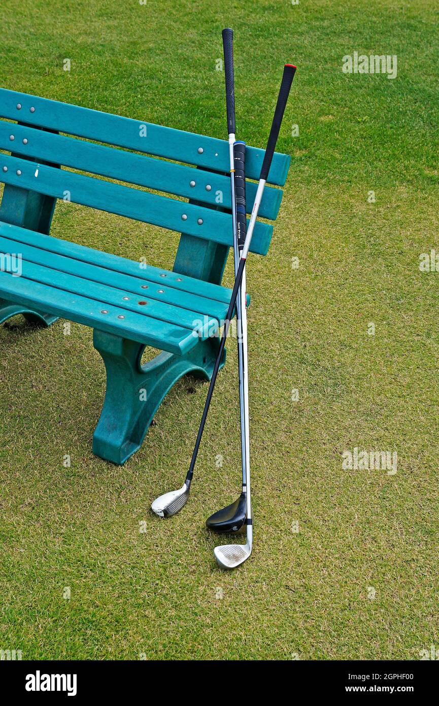RIO DE JANEIRO, BRAZIL - DECEMBER 11, 2019: Golf clubs on green bench ...