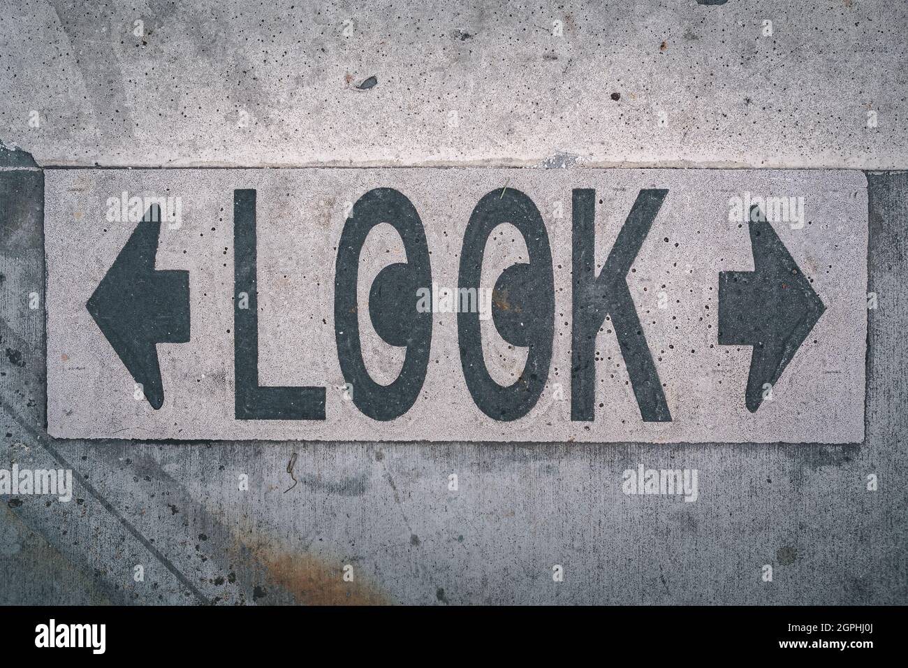 Close-up of a Look sign with arrows in both directions Stock Photo - Alamy