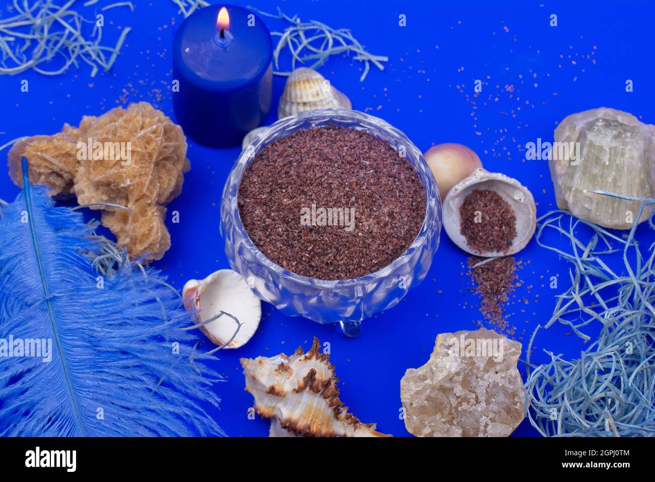 Spa products with sea shells and salt on blue background. Beauty ...