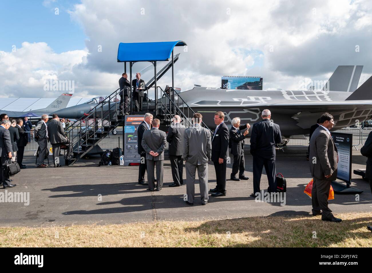 Businessmen viewing Lockheed Martin F-35 Lightning II fighter jet at ...