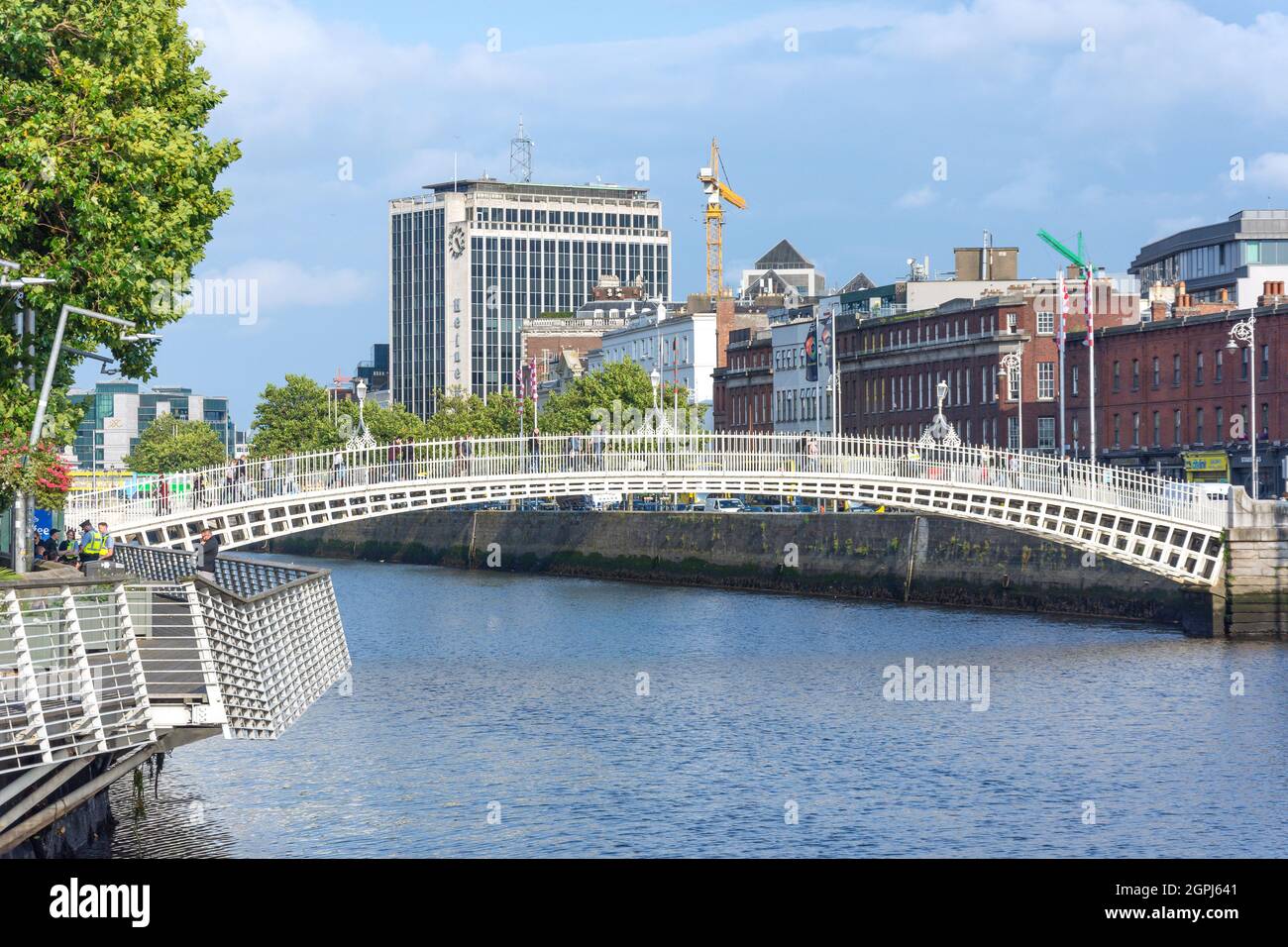19th century Ha'penny Bridge across River Liffey, Wellington Quay ...