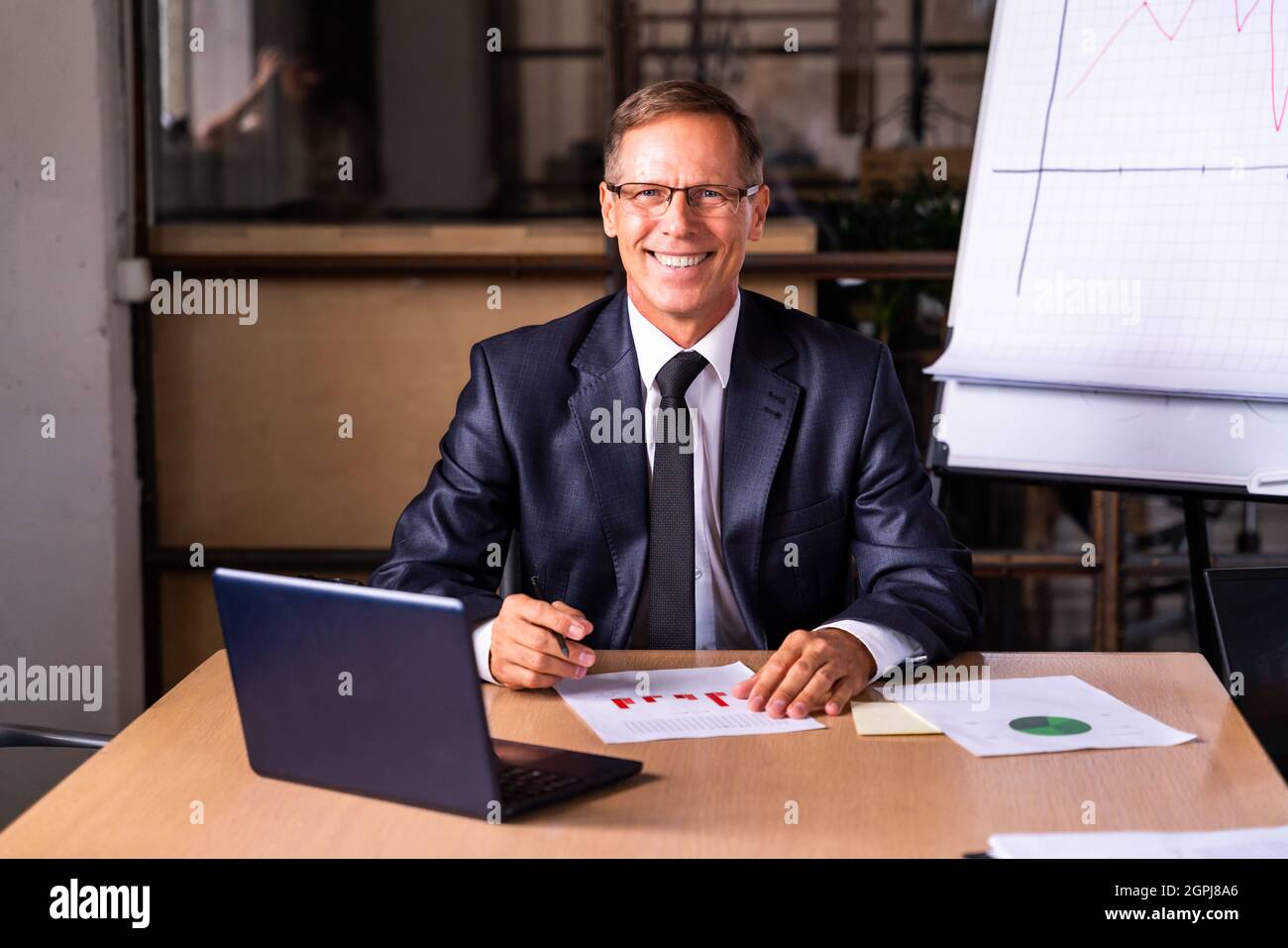 Business man with formal wear working in the office Stock Photo - Alamy
