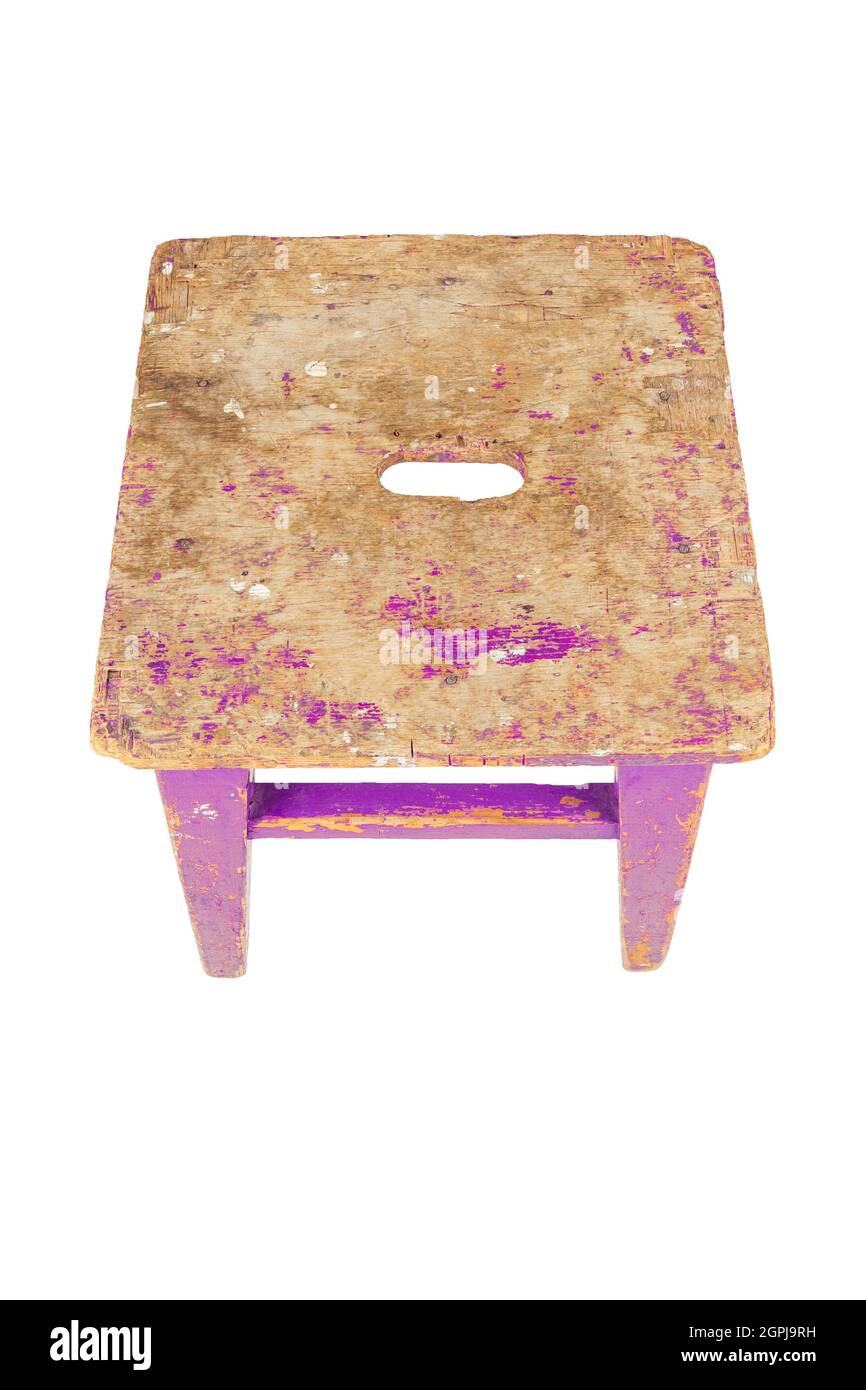 Old wooden stool with peeling pink paint. Loft style chair isolated on ...