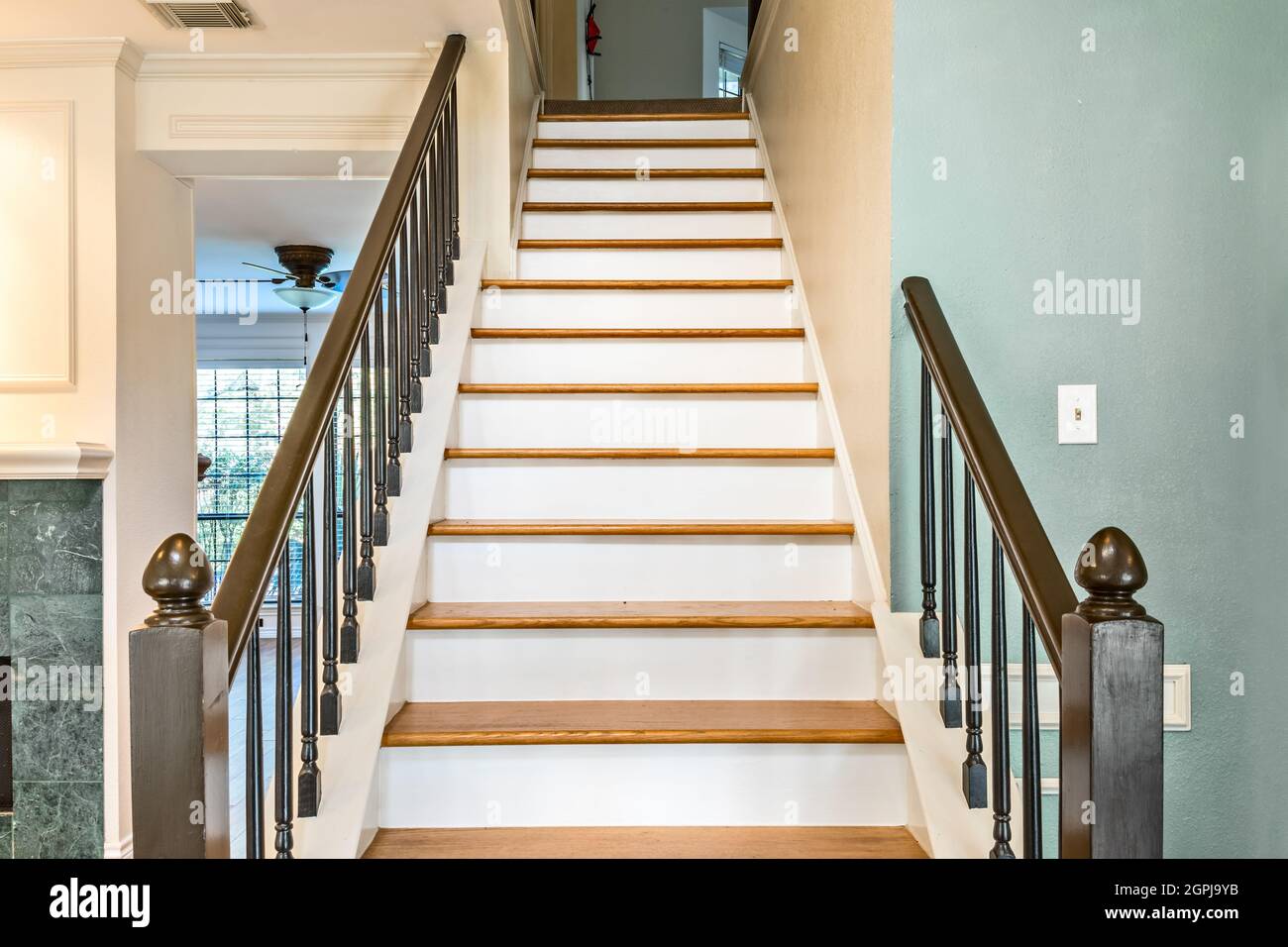 Interior of a single family room with the staircase leading to the ...