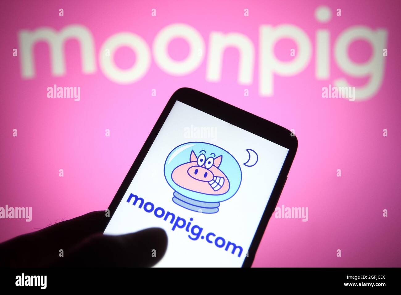 In this photo illustration a Moonpig.com logo is seen on a smartphone ...