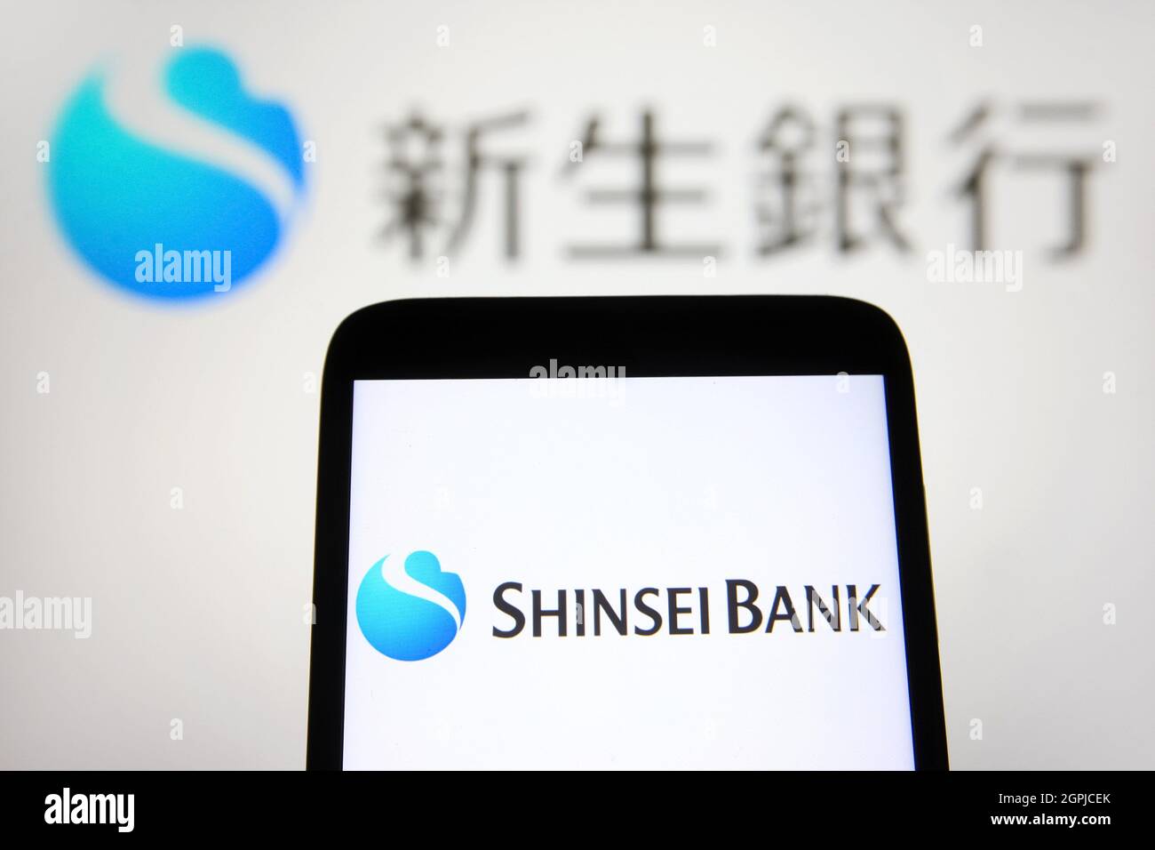 In this photo illustration a Shinsei Bank, Limited logo is seen on a ...
