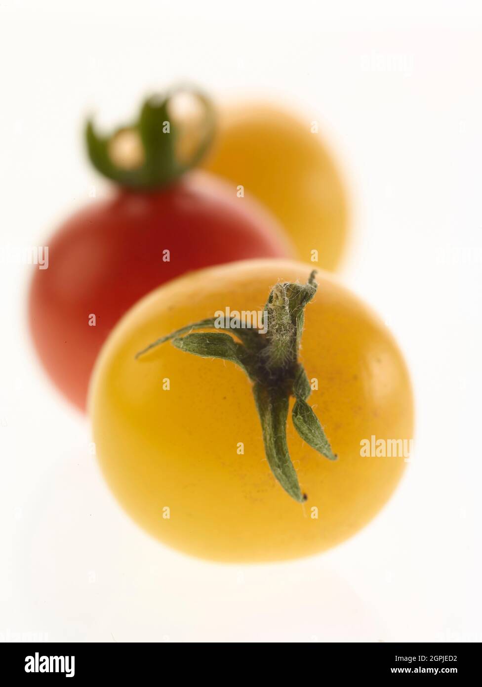 Bite sized tomato on white background, high resolution food ingredient ...