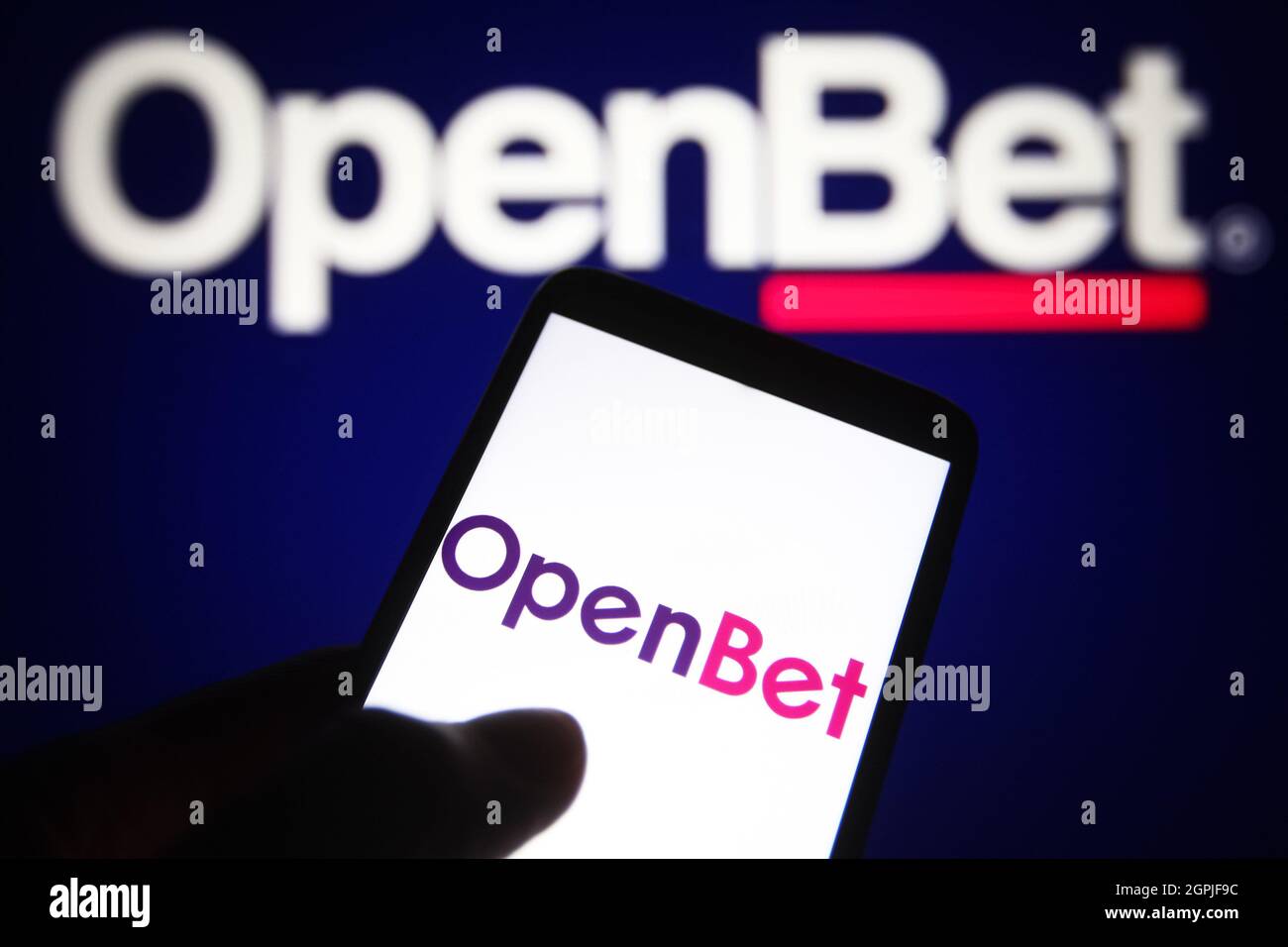 In this photo illustration an OpenBet logo is seen on a smartphone and ...