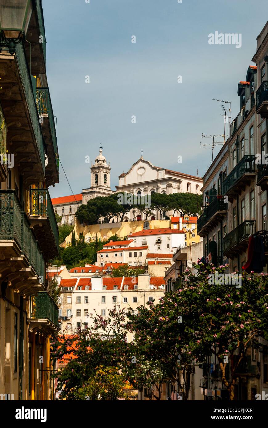 Streets of Lisbon with a view of the Church of Our Lady of Grace upon ...