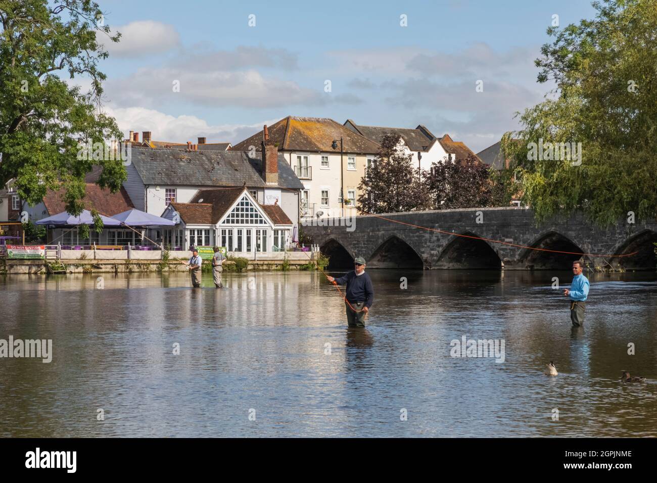 Town view and fly fisherman in the river avon hi-res stock photography ...