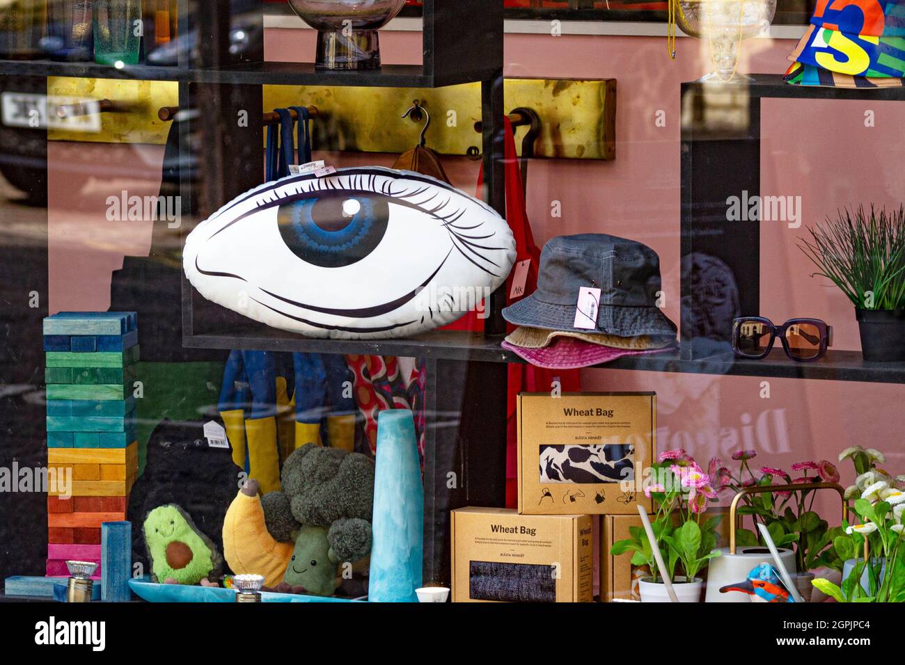 Shop window in Cambridge UK with prominent cushion looking like an eye ...