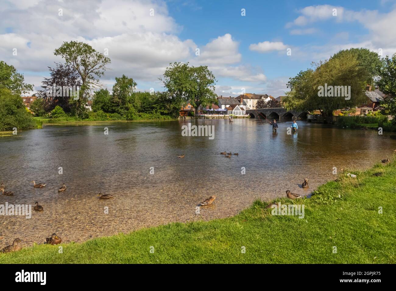 Town view and fly fisherman in the river avon hi-res stock photography ...