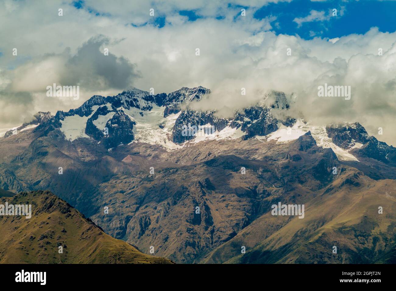 Snow covered peak looming above Sacred Valley of Incas, Peru Stock ...