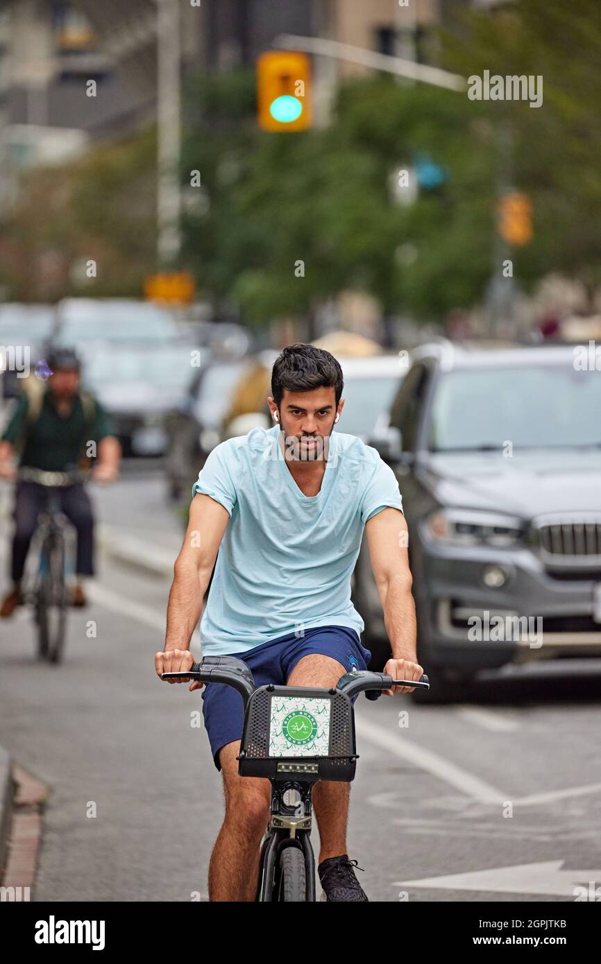 Toronto cyclists and pedestrians Stock Photo - Alamy