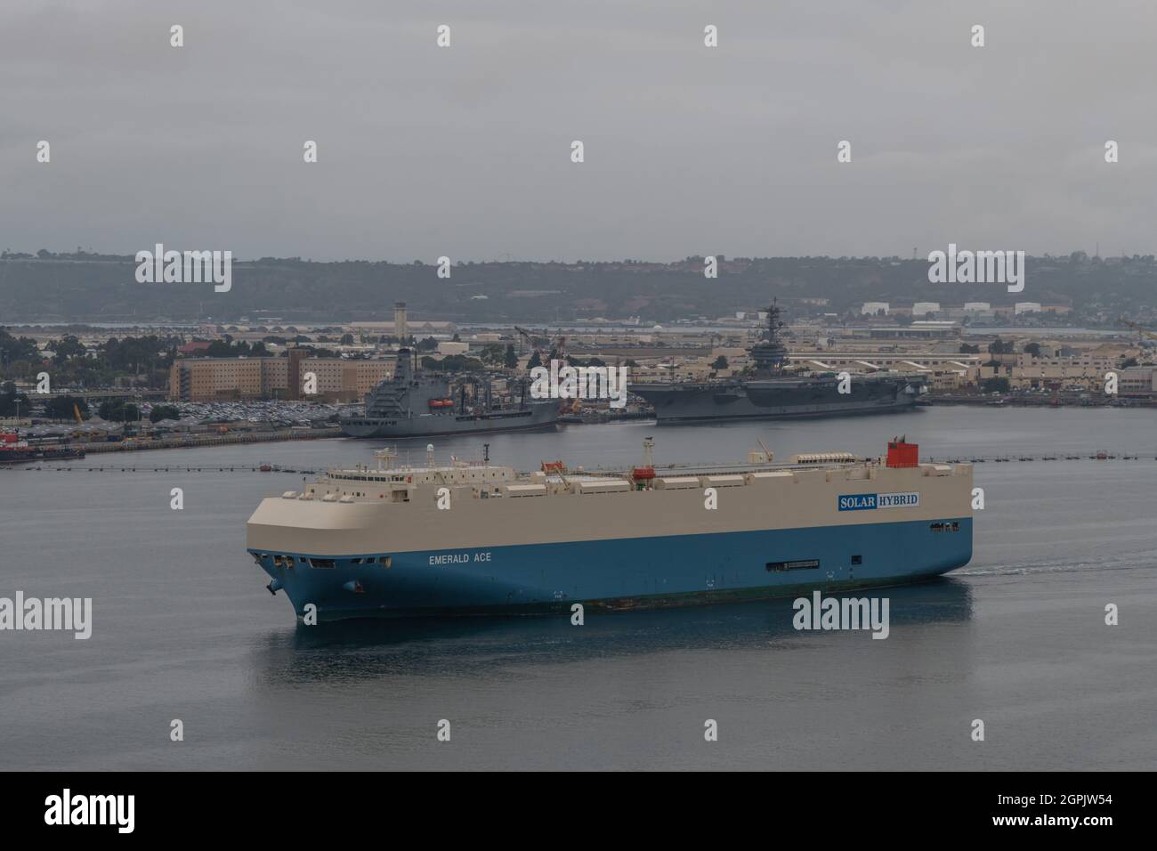 Scenic San Diego Bay vista with a hybrid solar ship passing by under a ...