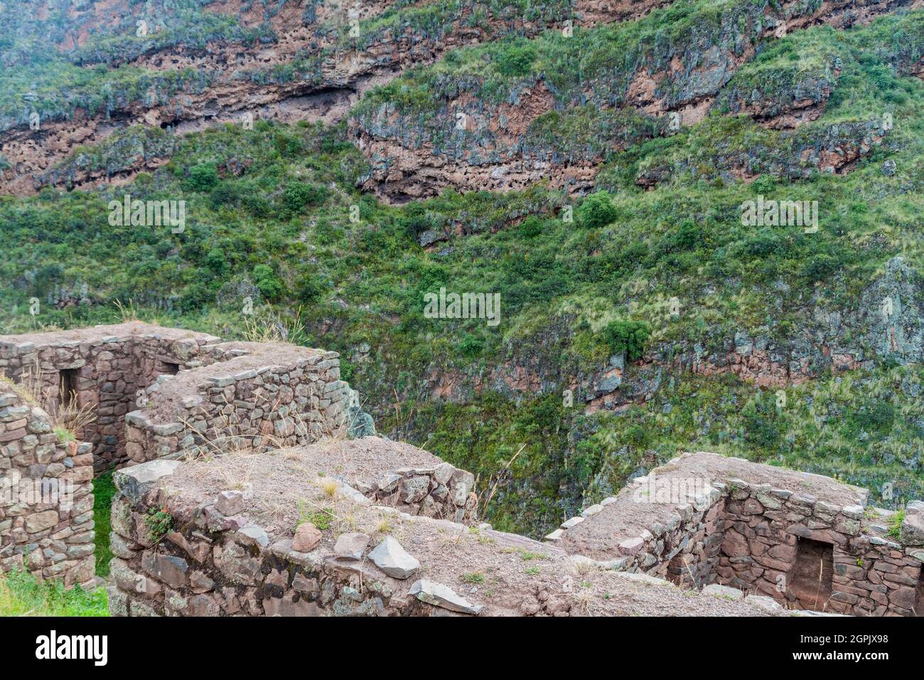 Ancient Inca's ruins Plundered Inca tombs in the background near Pisac ...
