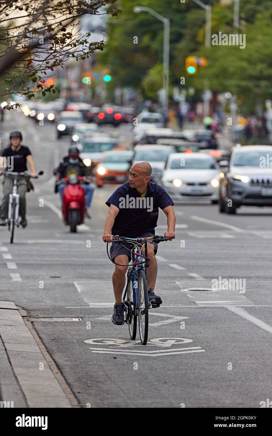 Toronto cyclists and pedestrians Stock Photo - Alamy