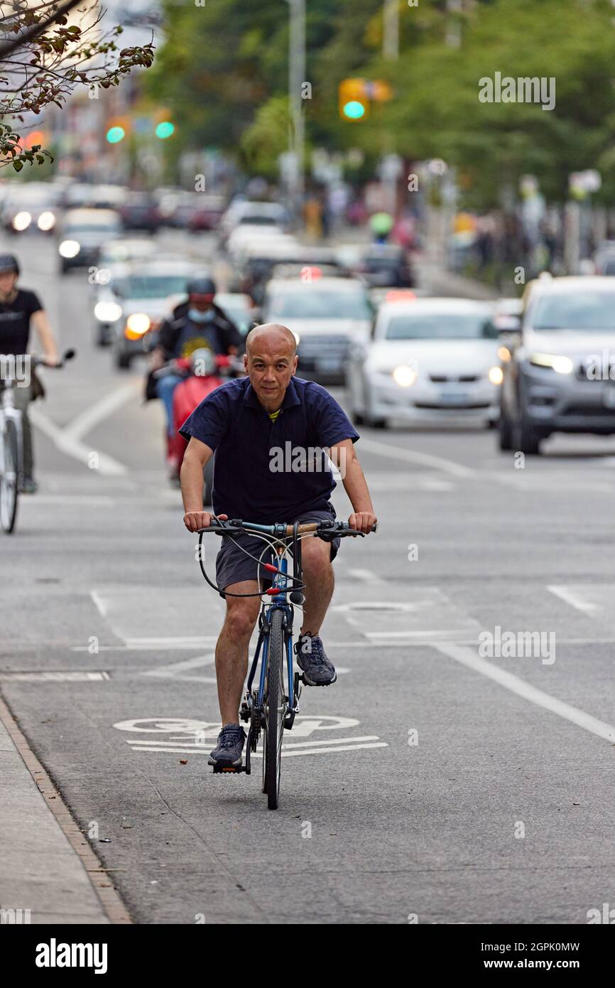 Toronto cyclists and pedestrians Stock Photo - Alamy