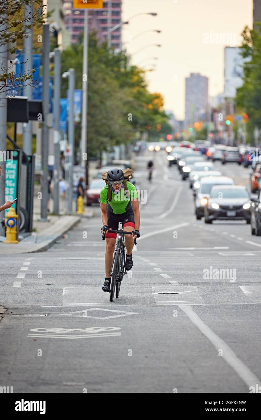 Toronto cyclists and pedestrians Stock Photo - Alamy