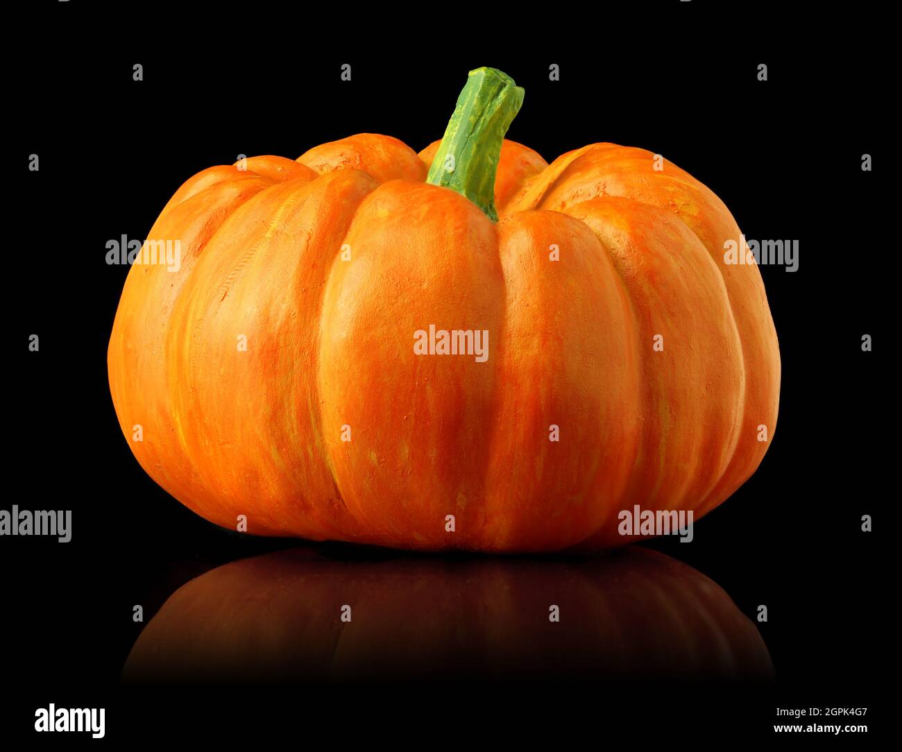 Single orange pumpkin isolated on black Stock Photo - Alamy