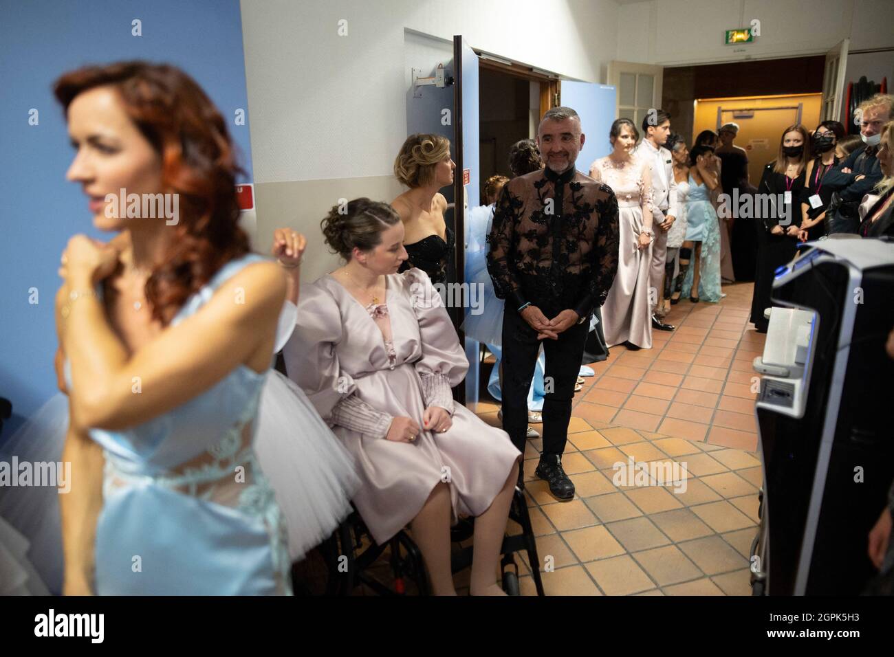 Amputee models preparations in backstage to display creations by ...