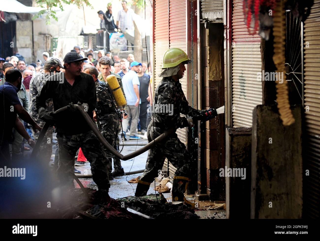 Damascus, Syria. 29th Sep, 2021. Firefighters try to extinguish a huge ...