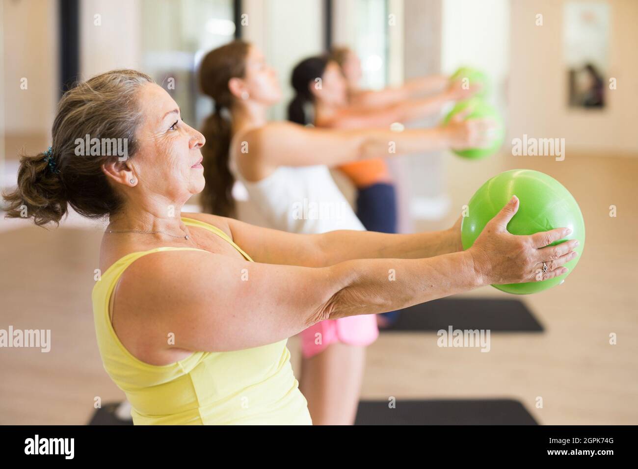 Women holding bender balls in hands Stock Photo - Alamy