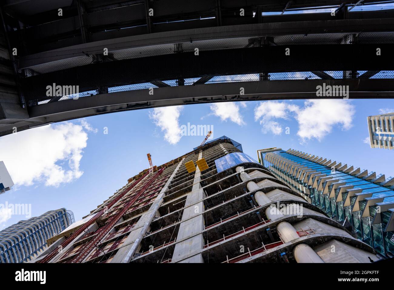 Ground angle photo looking directly up towards highrise towers in the ...
