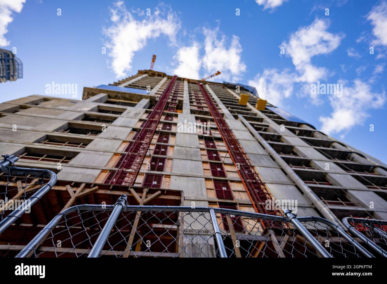 Ground angle photo looking directly up towards highrise towers in the ...