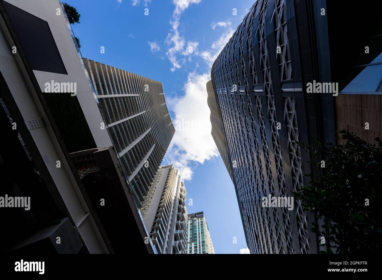 Ground angle photo looking directly up towards highrise towers in the ...