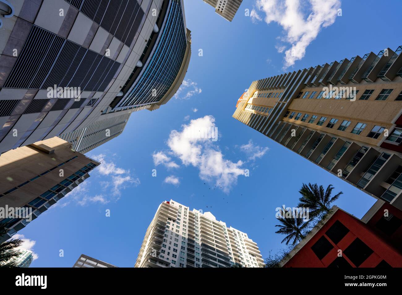 Ground angle photo looking directly up towards highrise towers in the ...