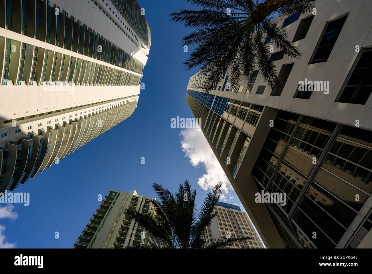 Ground angle photo looking directly up towards highrise towers in the ...