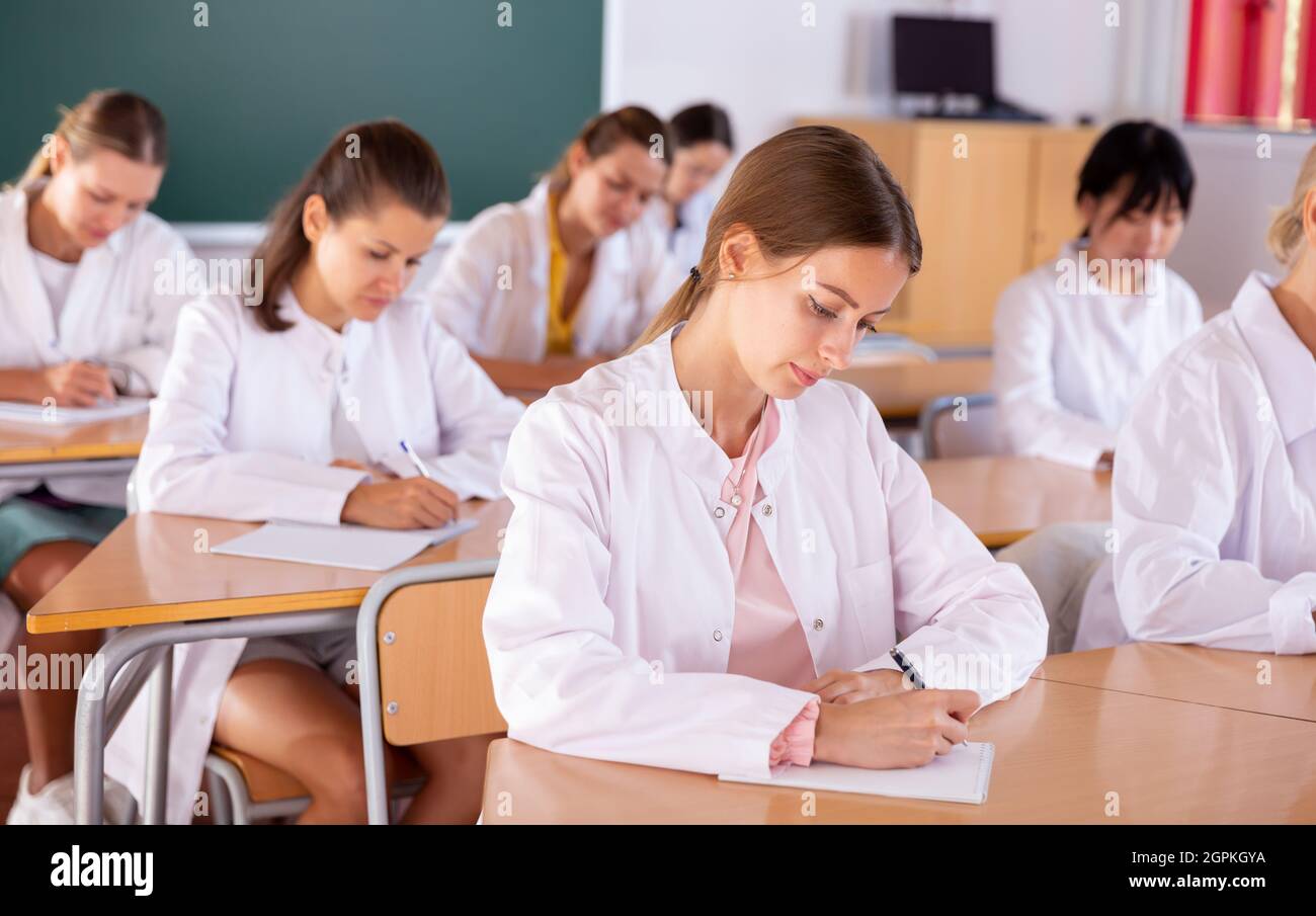 Medical students writing in notepads Stock Photo - Alamy