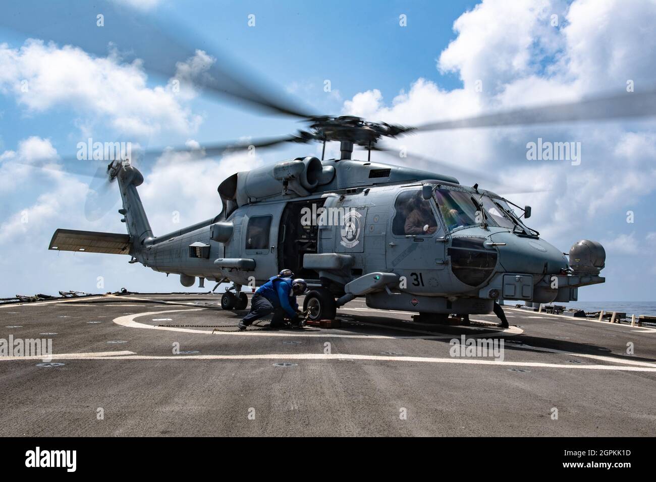 210927-N-MR124-1039 ARABIAN SEA (Sept. 27, 2021) Sailors secure an MH ...