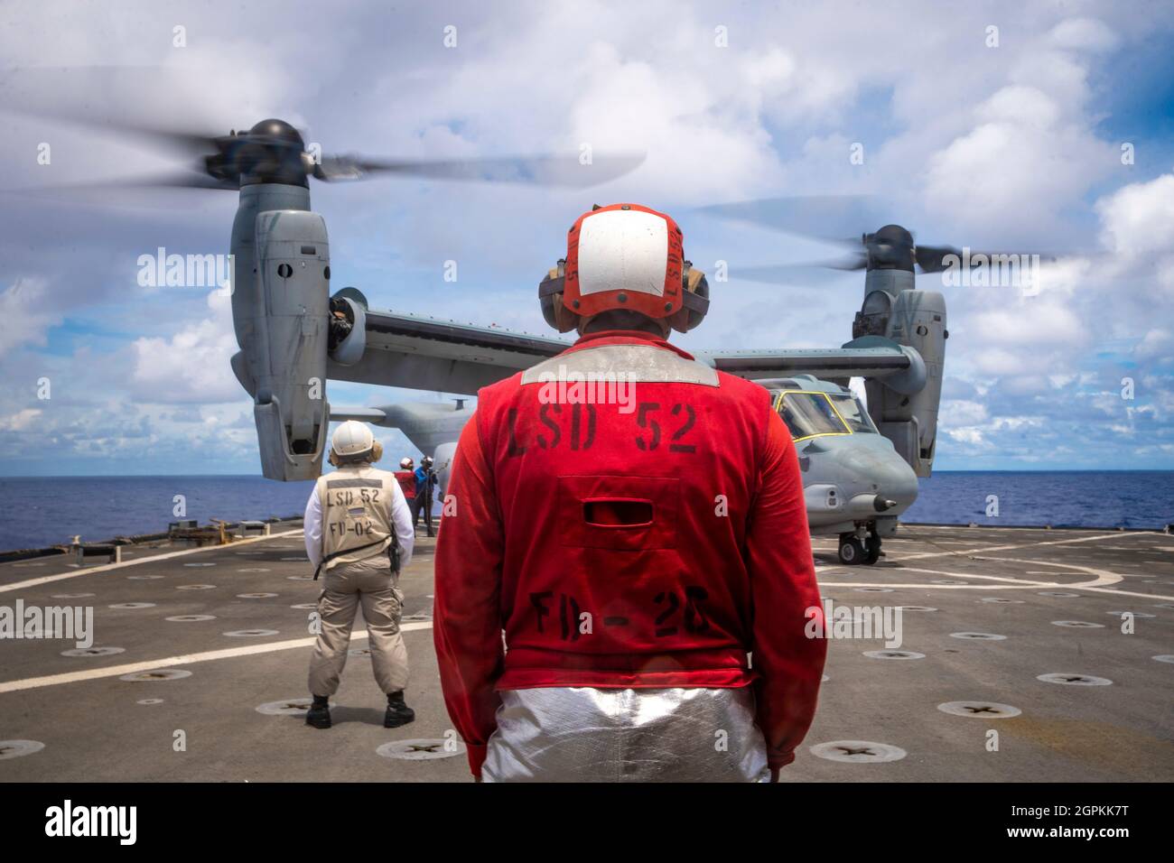 U.S. Sailors assigned to amphibious dock landing ship USS Pearl Harbor ...