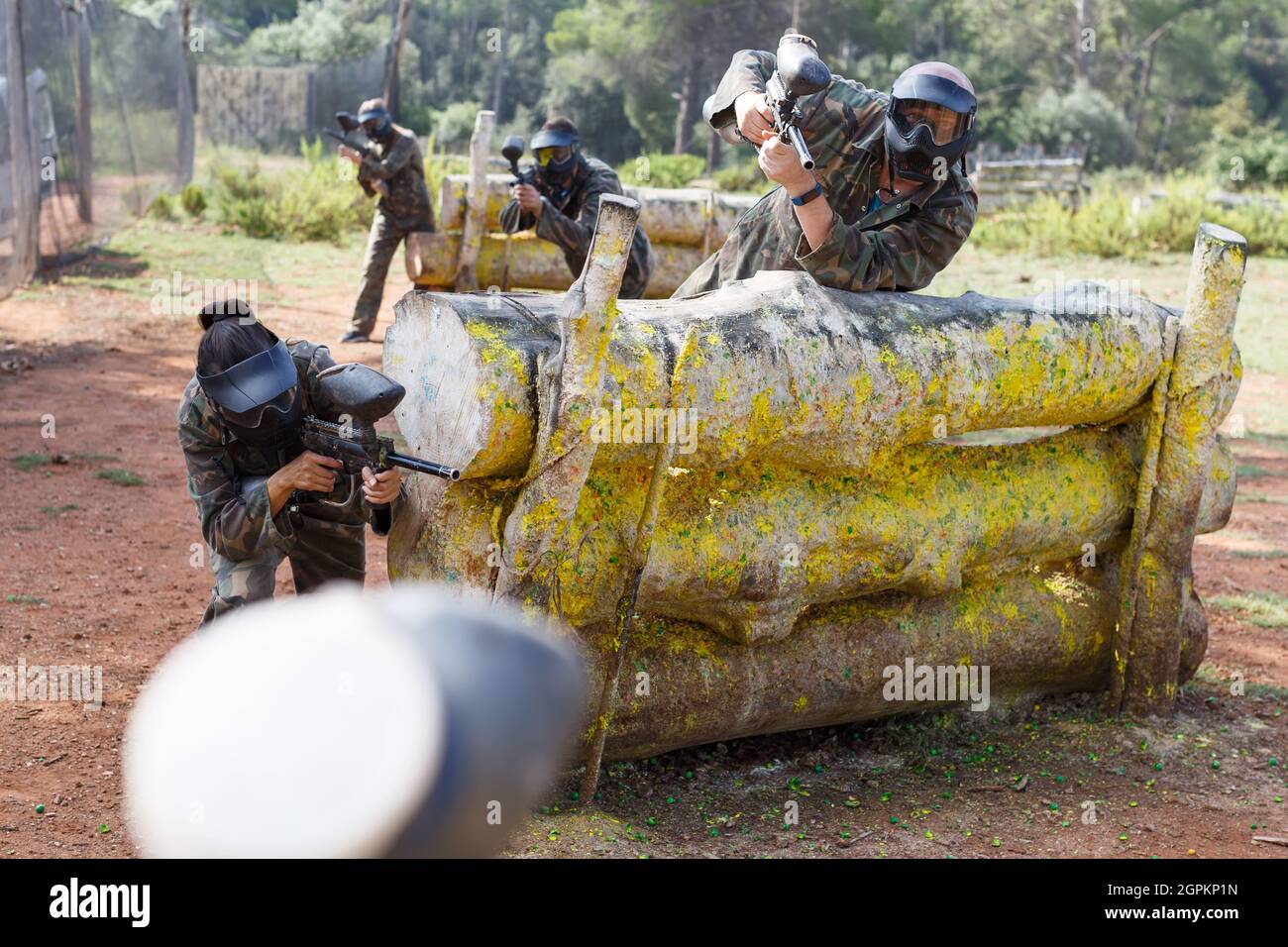 Paintball players playing outdoors Stock Photo - Alamy