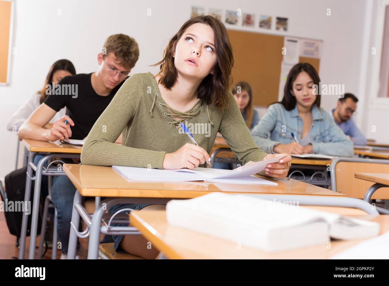Teenage student answering question studying hi-res stock photography ...