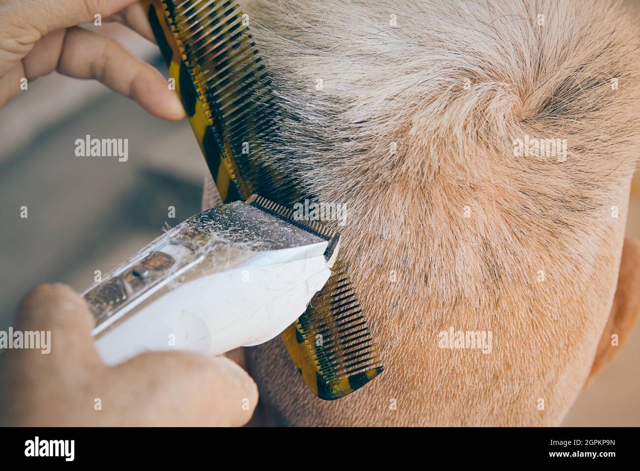 Zoom Clipper and Comb in Hand of Barber or Hairdresser on Back Left Old ...