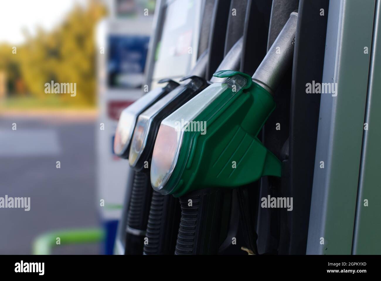 Fuel pumps station in close up with copy space, fuel nozzles at the gas ...