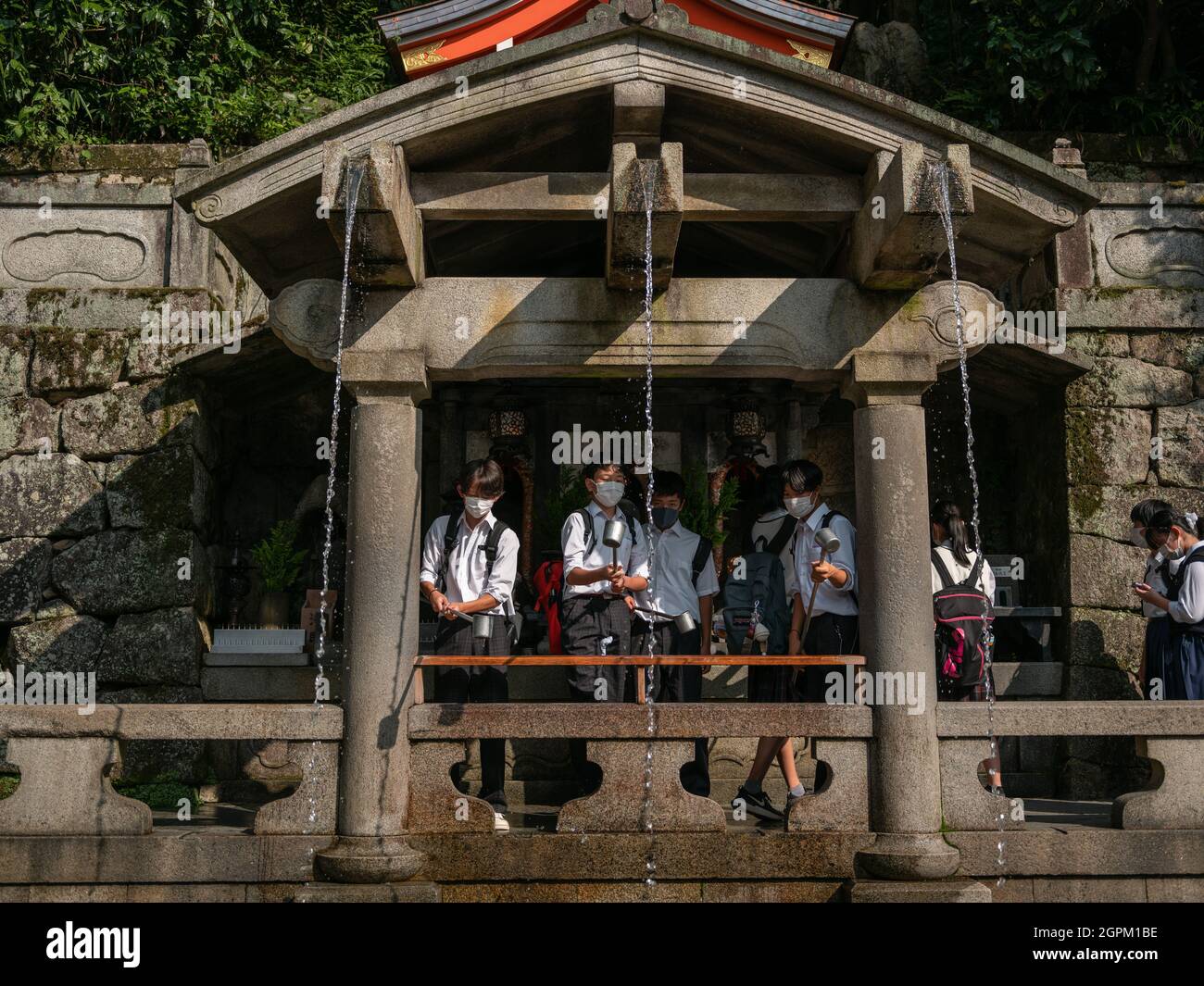 A group of Junior high school students wearing facial protective masks ...