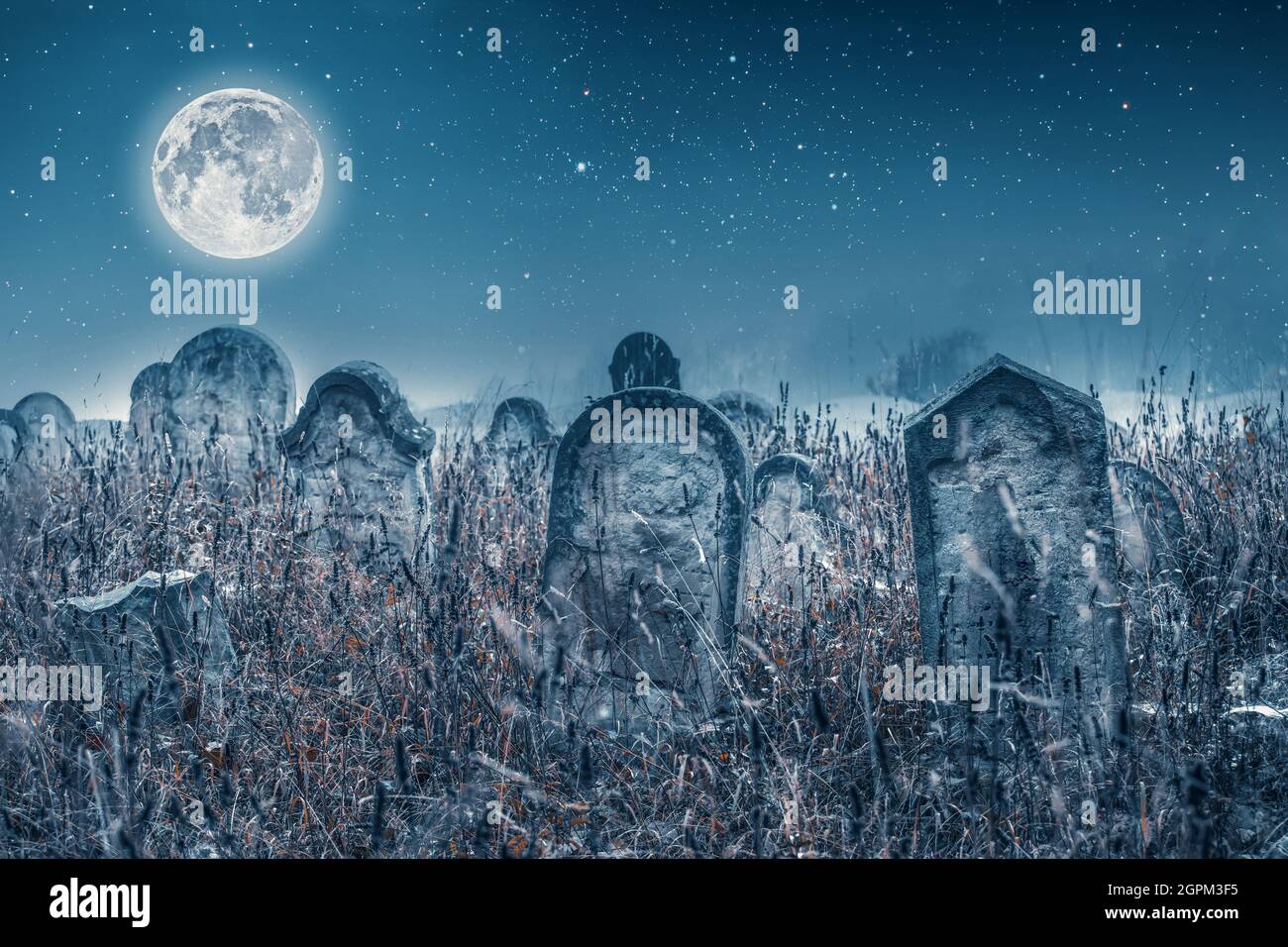Tombstones in cemetery at night with full moon. Halloween concept Stock ...