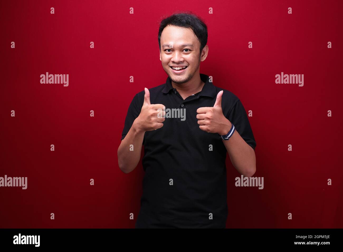 Happy Young Asian man with smiling face and thumbs up or ok sign Stock ...