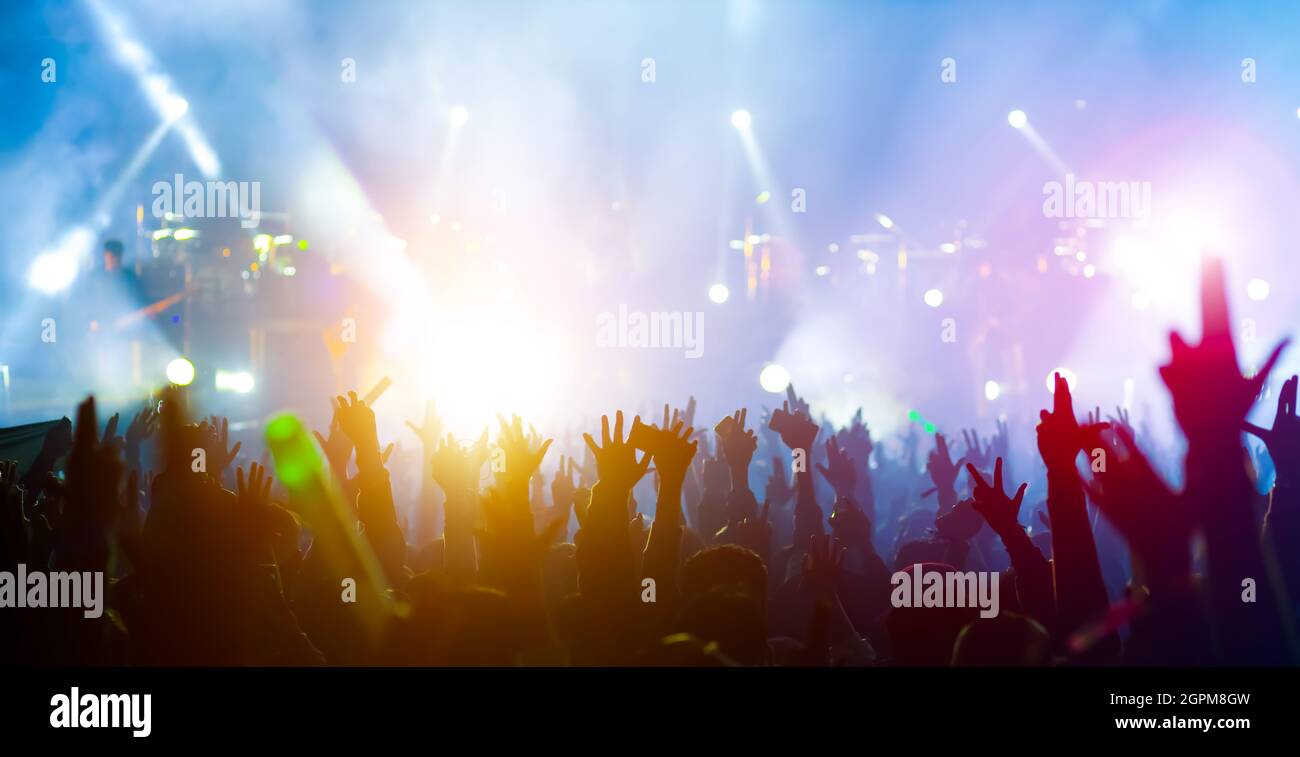 crowd with raised hands at concert festival Stock Photo - Alamy