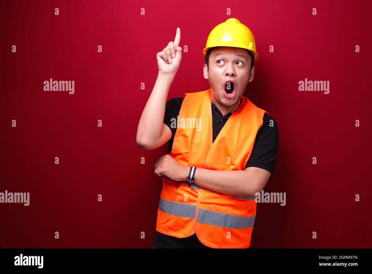Shock Young asian man worker is surprised and shouting wow with ...