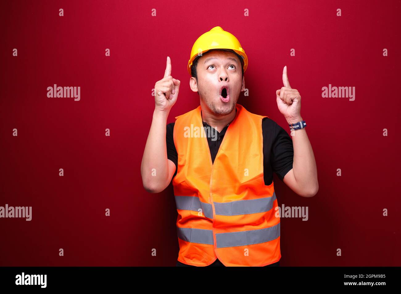 Shock Young asian man worker is surprised and shouting wow with ...